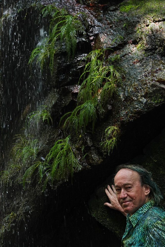 Patrick Blanc in front of the vertical cliff covered by Hydrostachys ...