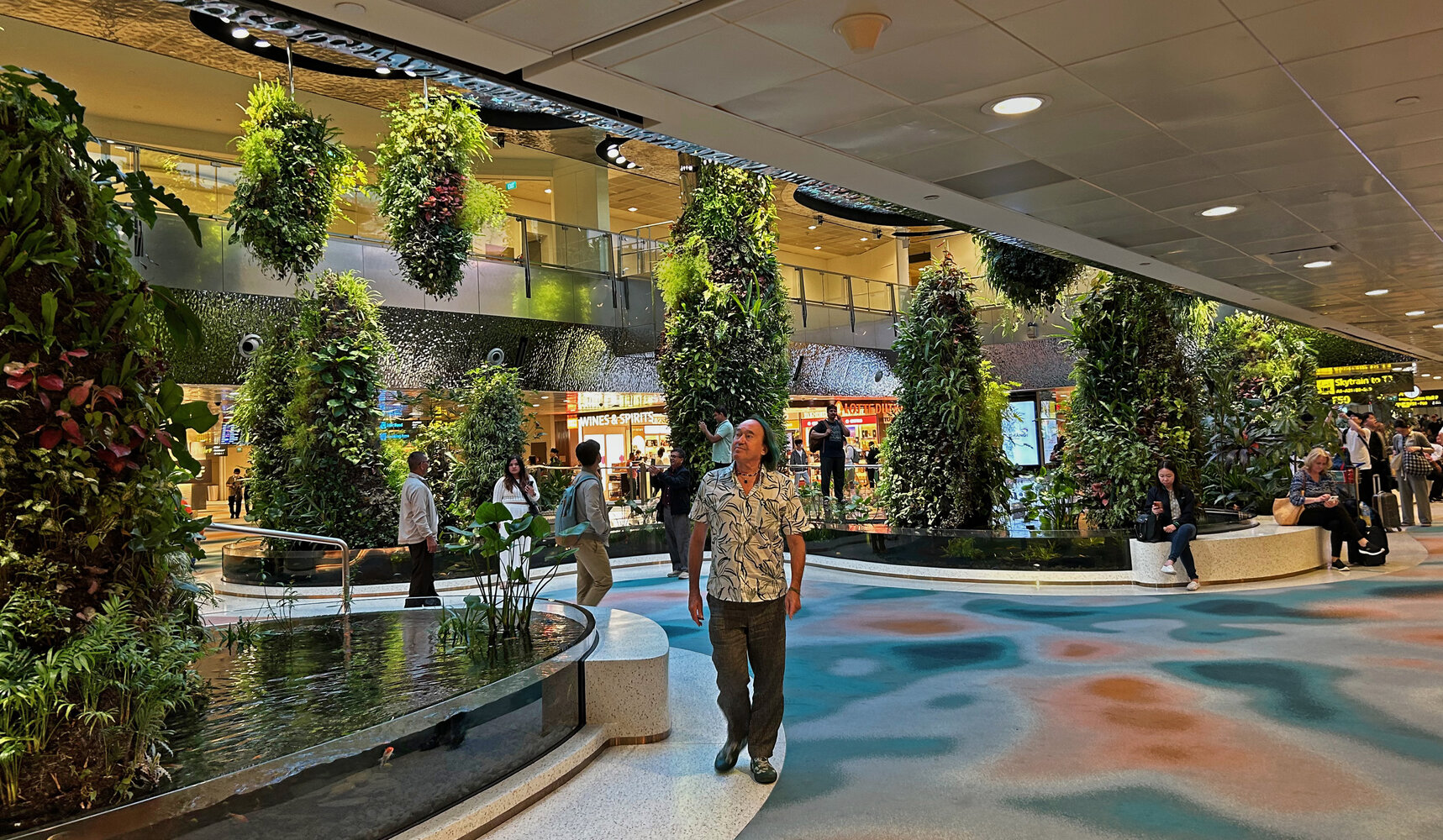 Patrick Blanc walking along the Dreamscape garden at Changi T 2 airport ...